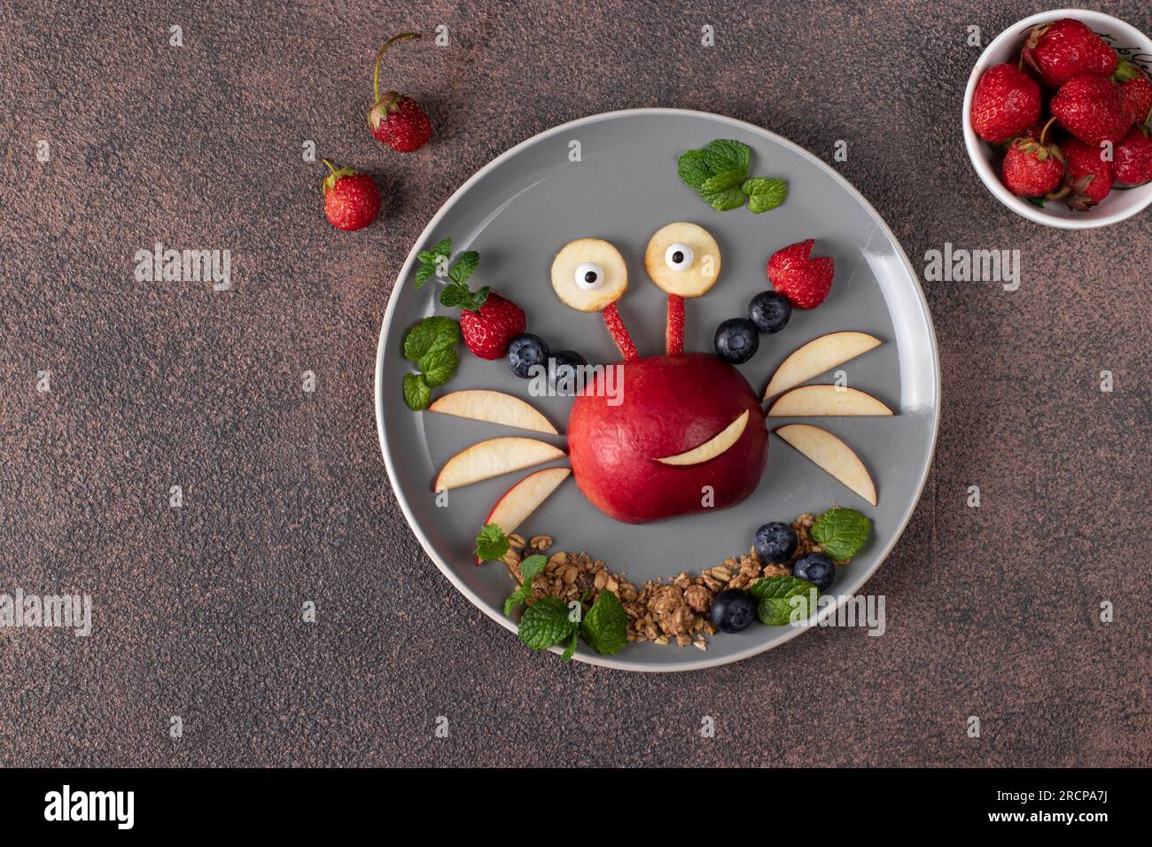 Sea crab made from fruits and berries such as apple, strawberry and ...