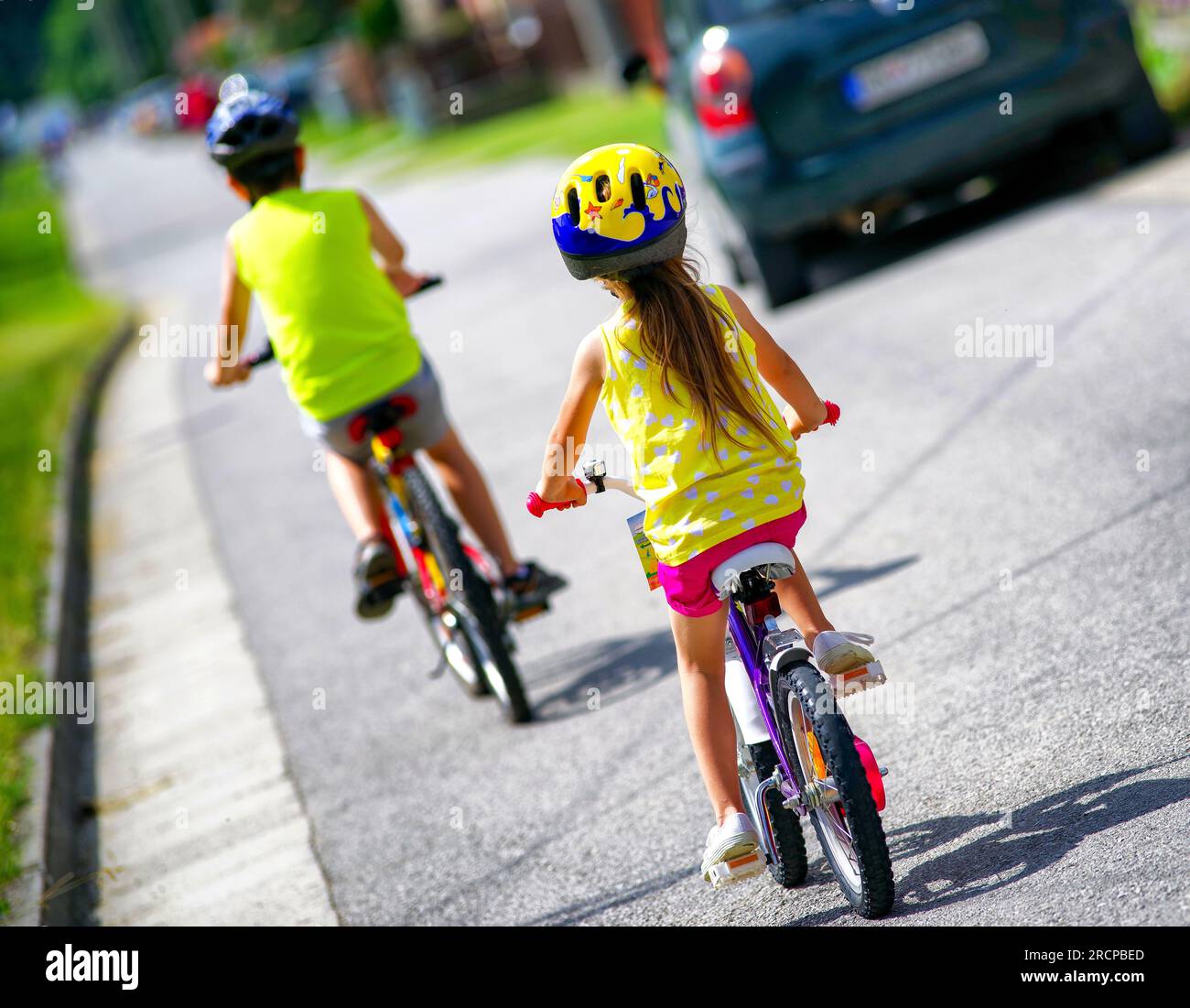 Child cycle street cars hi-res stock photography and images - Alamy