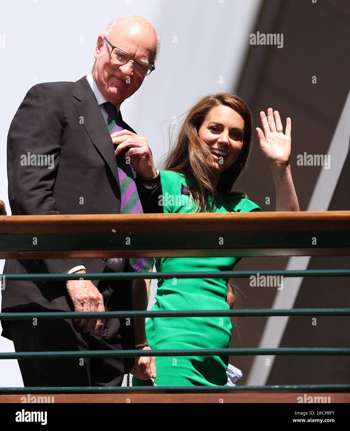 The Princess of Wales, is accompanied across the players bridge by ...