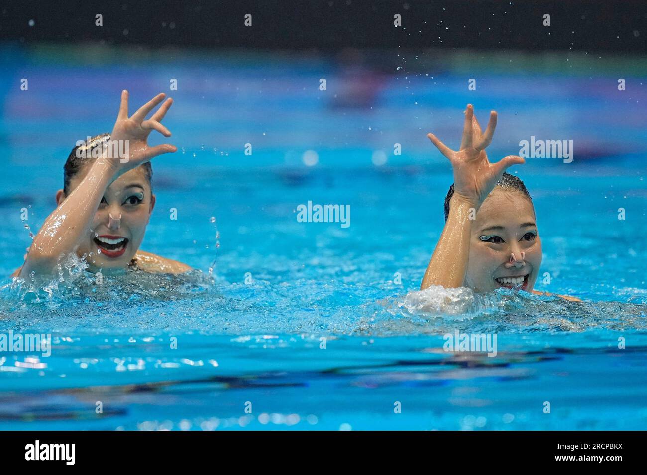 Mashiro Yasunaga and Moe Higa, of Japan, compete in the women's duet ...