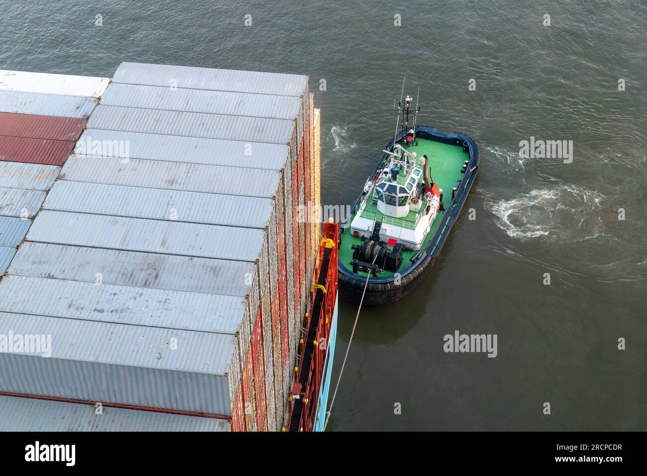 High angle view of the stern of a large container ship loaded with ...