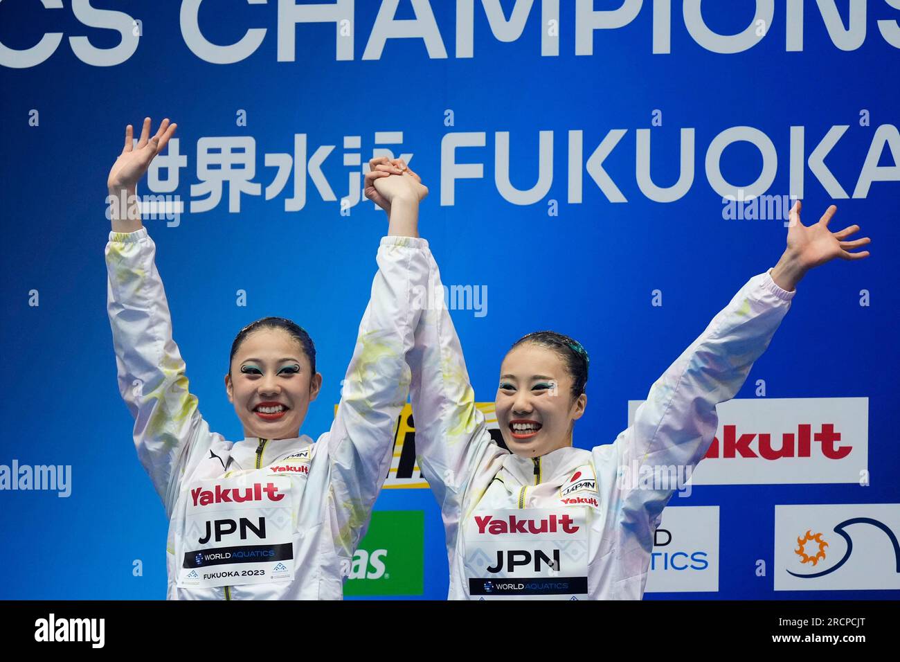 Mashiro Yasunaga and Moe Higa, of Japan, celebrate after winning gold ...