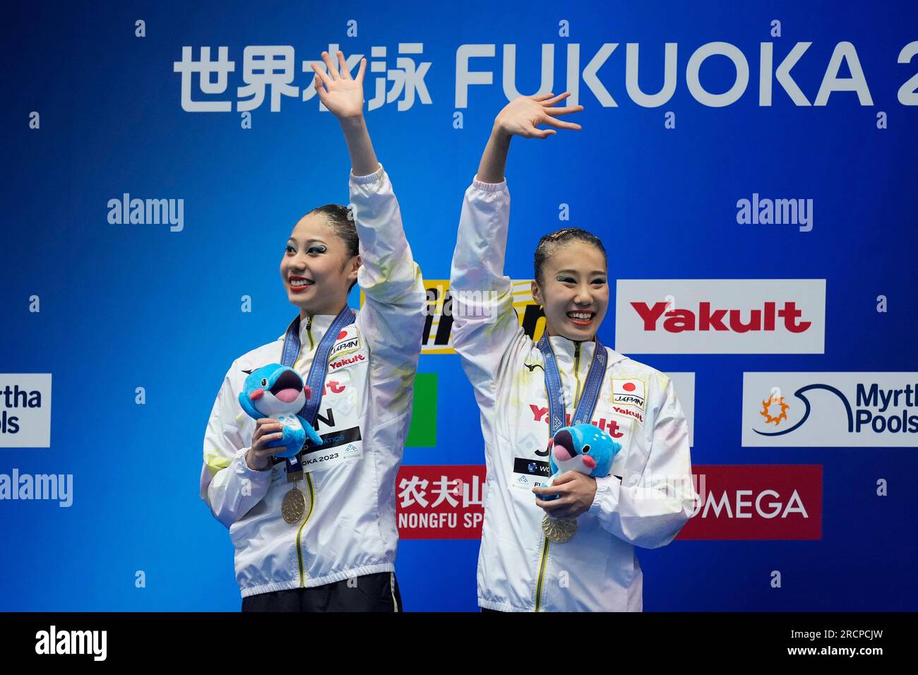 Mashiro Yasunaga and Moe Higa, of Japan, celebrate after winning gold ...