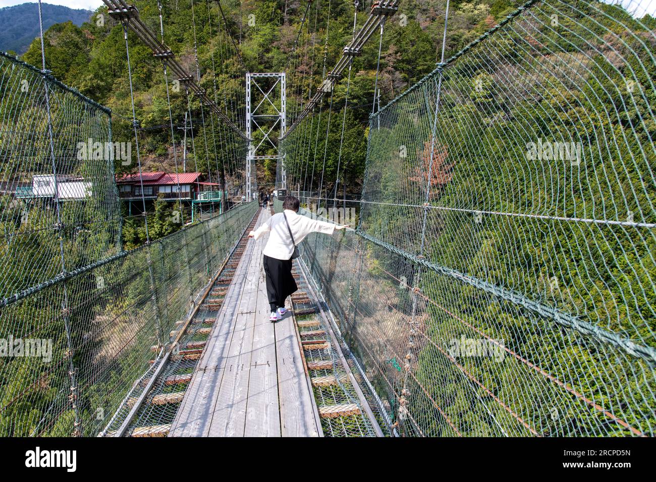 Totsukawa, Nara, Japan-3 April 2023; People walking on Tanize ...