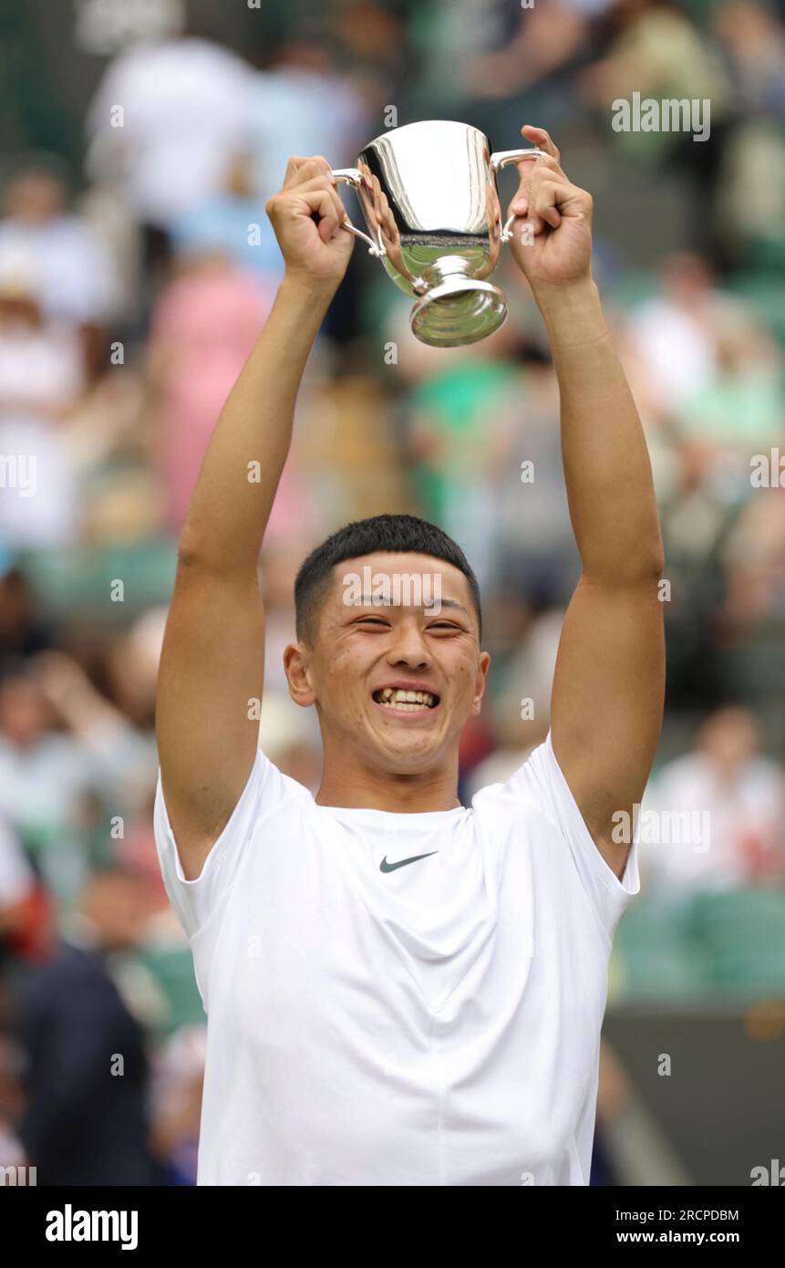 Tokito Oda of Japan holds a victory trophy during an award ceremony of ...
