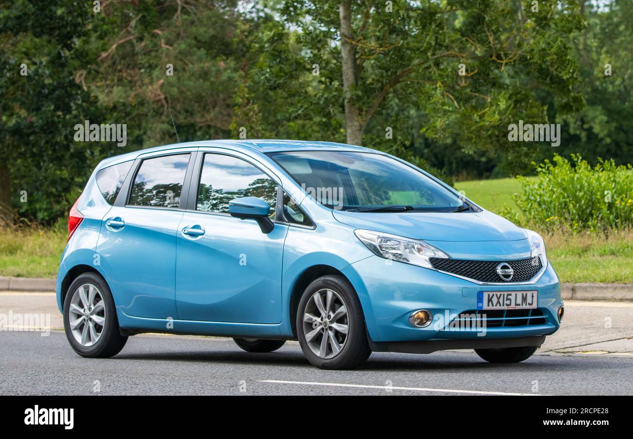 Milton Keynes, UK - July 16th 2023: 2015 blue NISSAN NOTE car driving ...