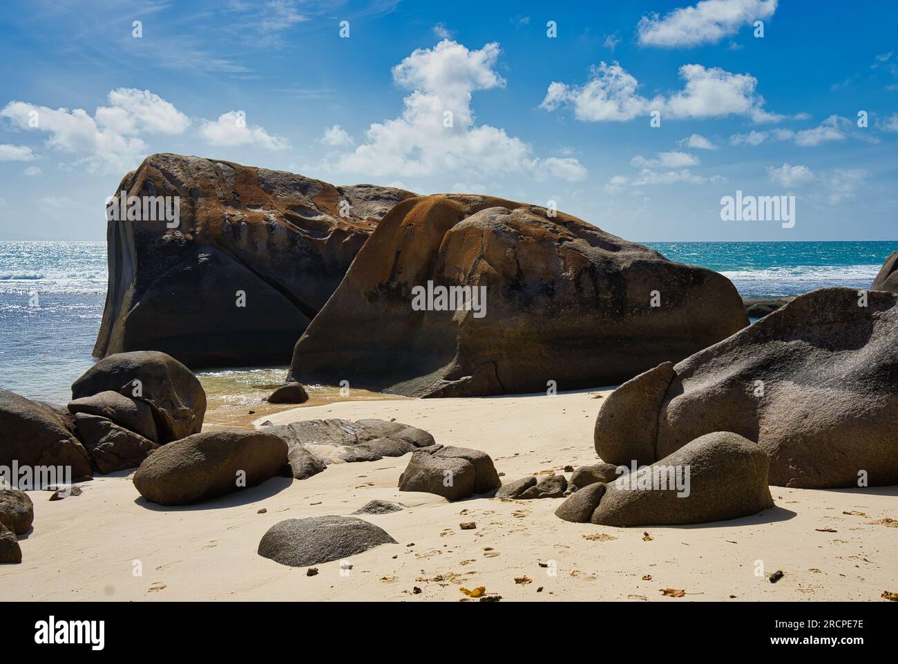 Rock boulders on the beach of the carana, Mahe Seychelles Stock Photo ...
