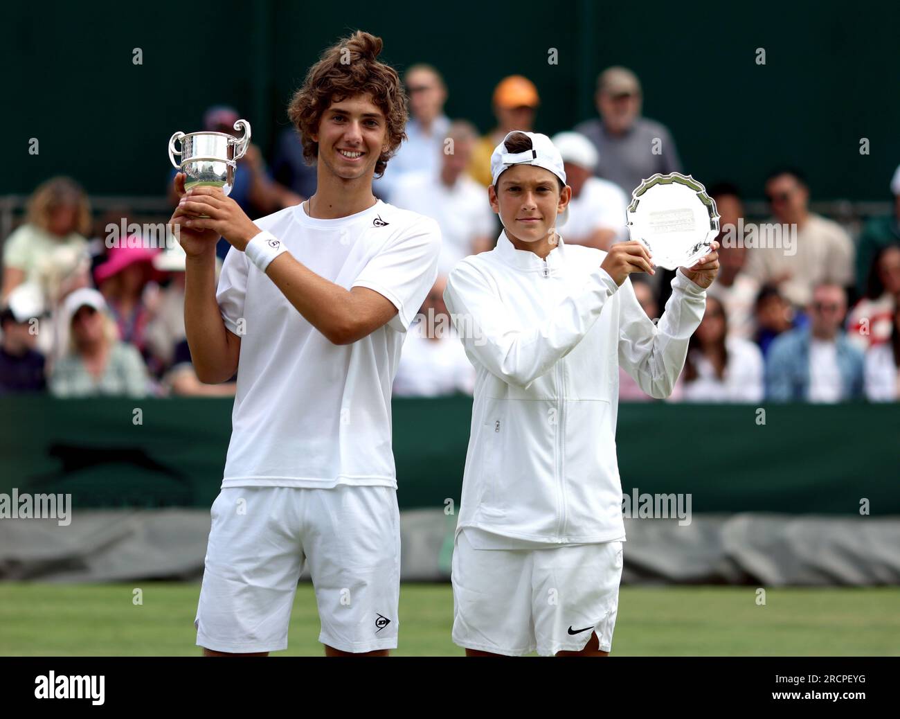 Mark Ceban celebrates with the trophy following the Boys 14 & Under ...