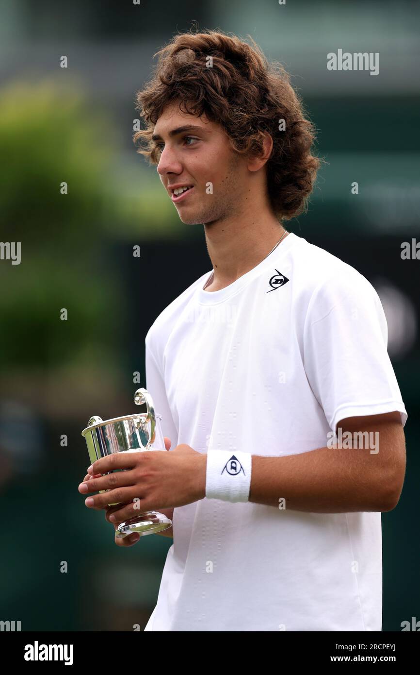 Mark Ceban celebrates with the trophy following the Boys 14 & Under ...