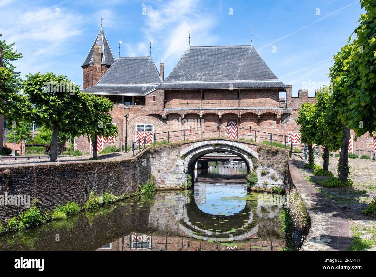 View over Eem canal towards the medieval gate Koppelpoort in Amersfoort ...