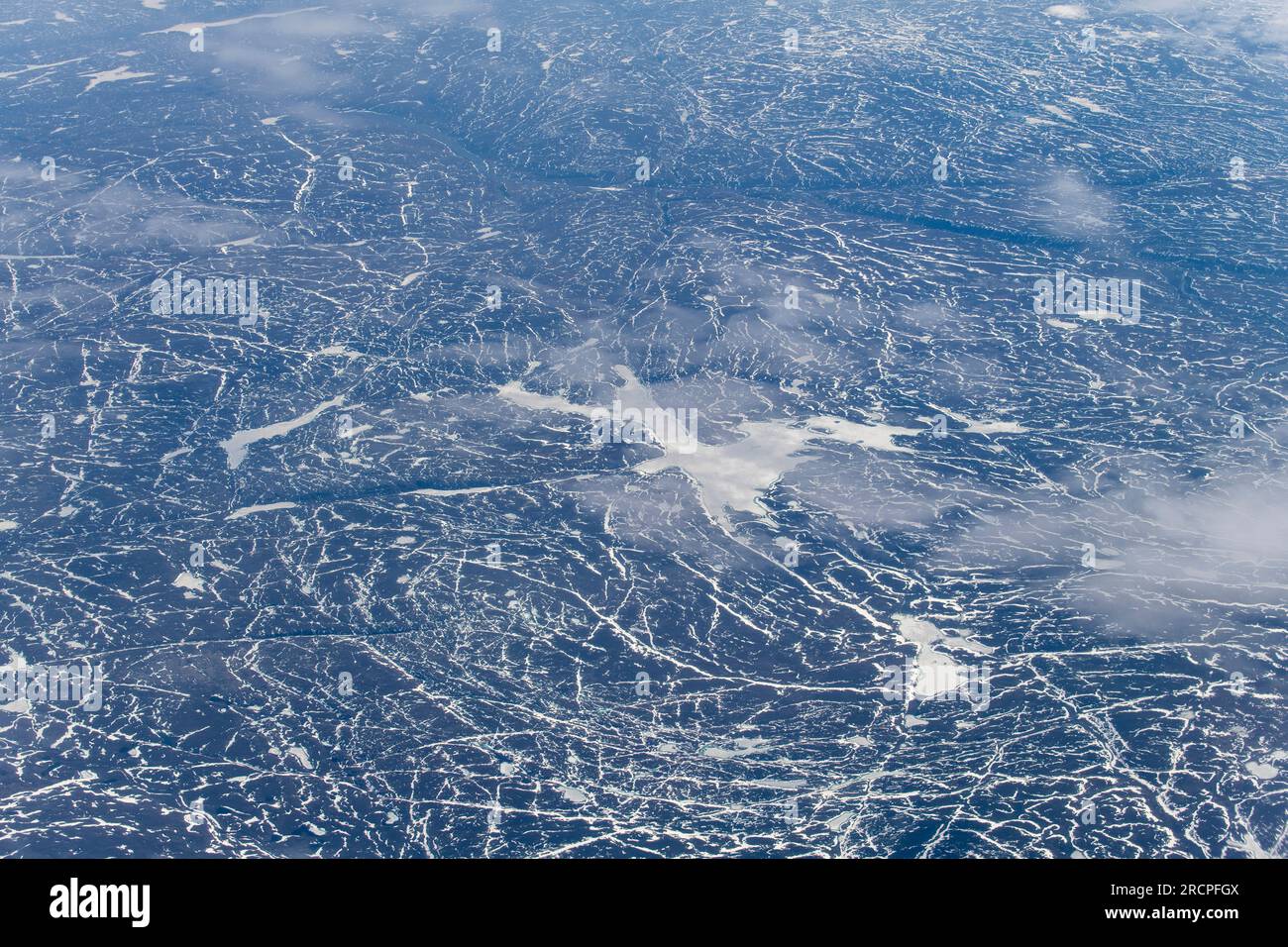Aerial view at 38,000 feet of part of the landmass of Nunavut, a ...