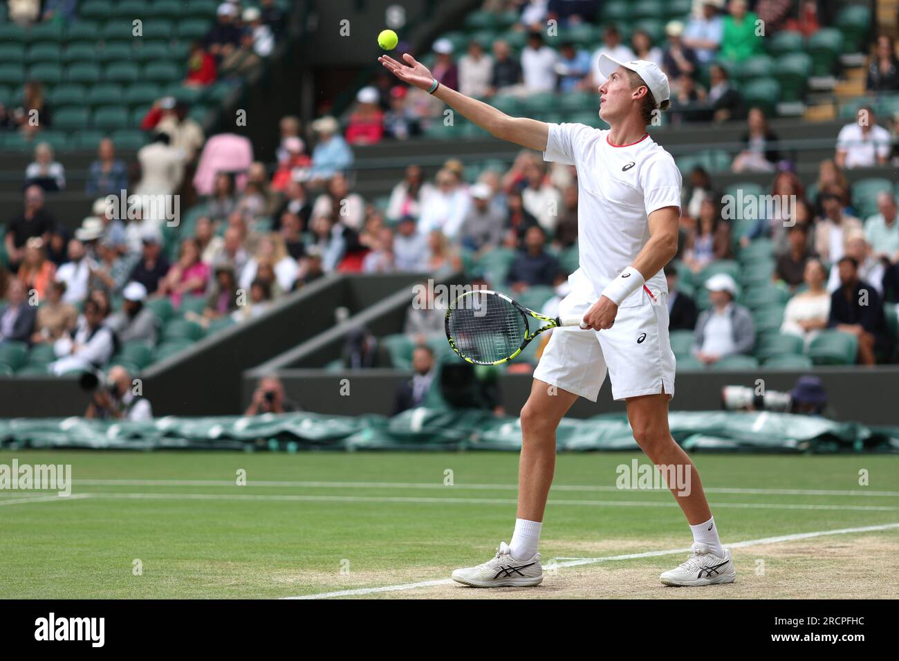 Henry Searle in action against Yaroslav Demin during the Boys' Singles ...