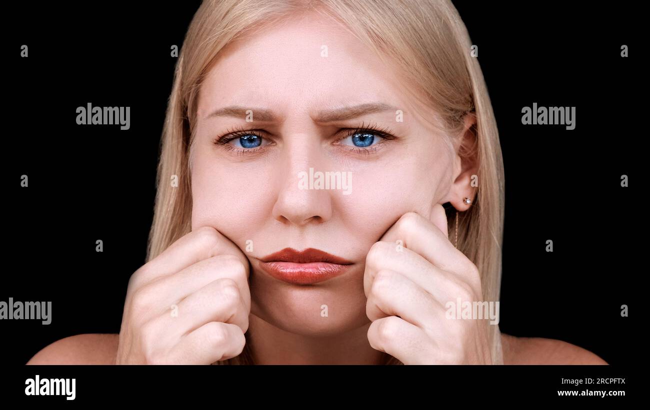 Second chin, obesity. Portrait of a 30-year-old woman pulling back the ...