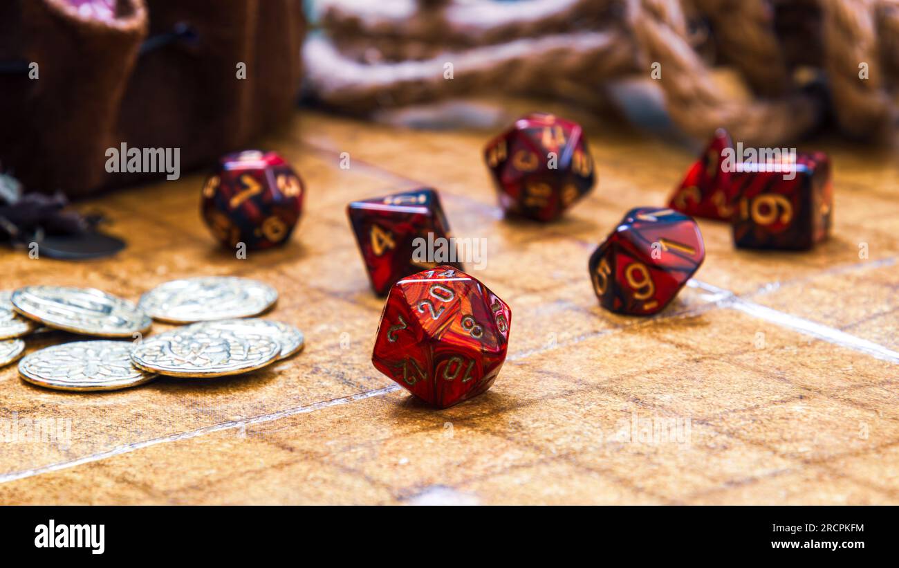 low angle shot featuring a collection of vibrant red RPG dice and ...