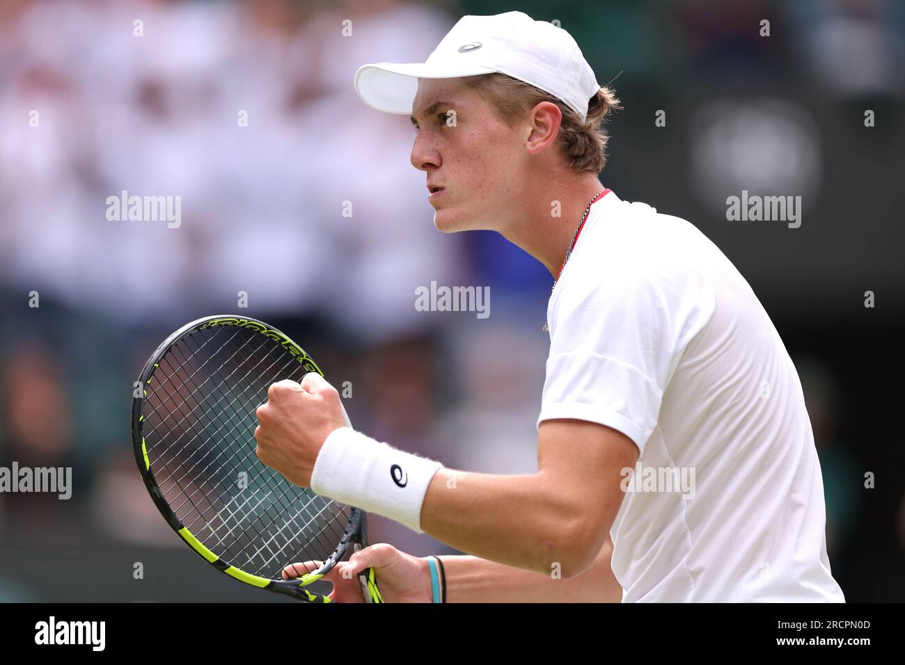 Henry Searle celebrates a point against Yaroslav Demin during the Boys ...