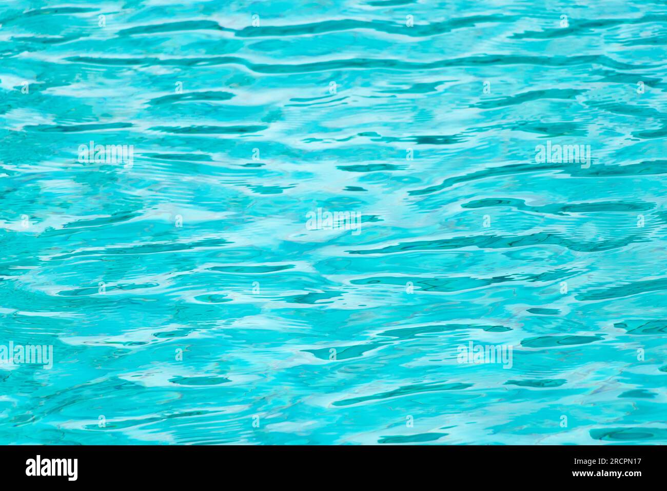 Ripple Water in swimming pool with blue tile floor background Stock ...