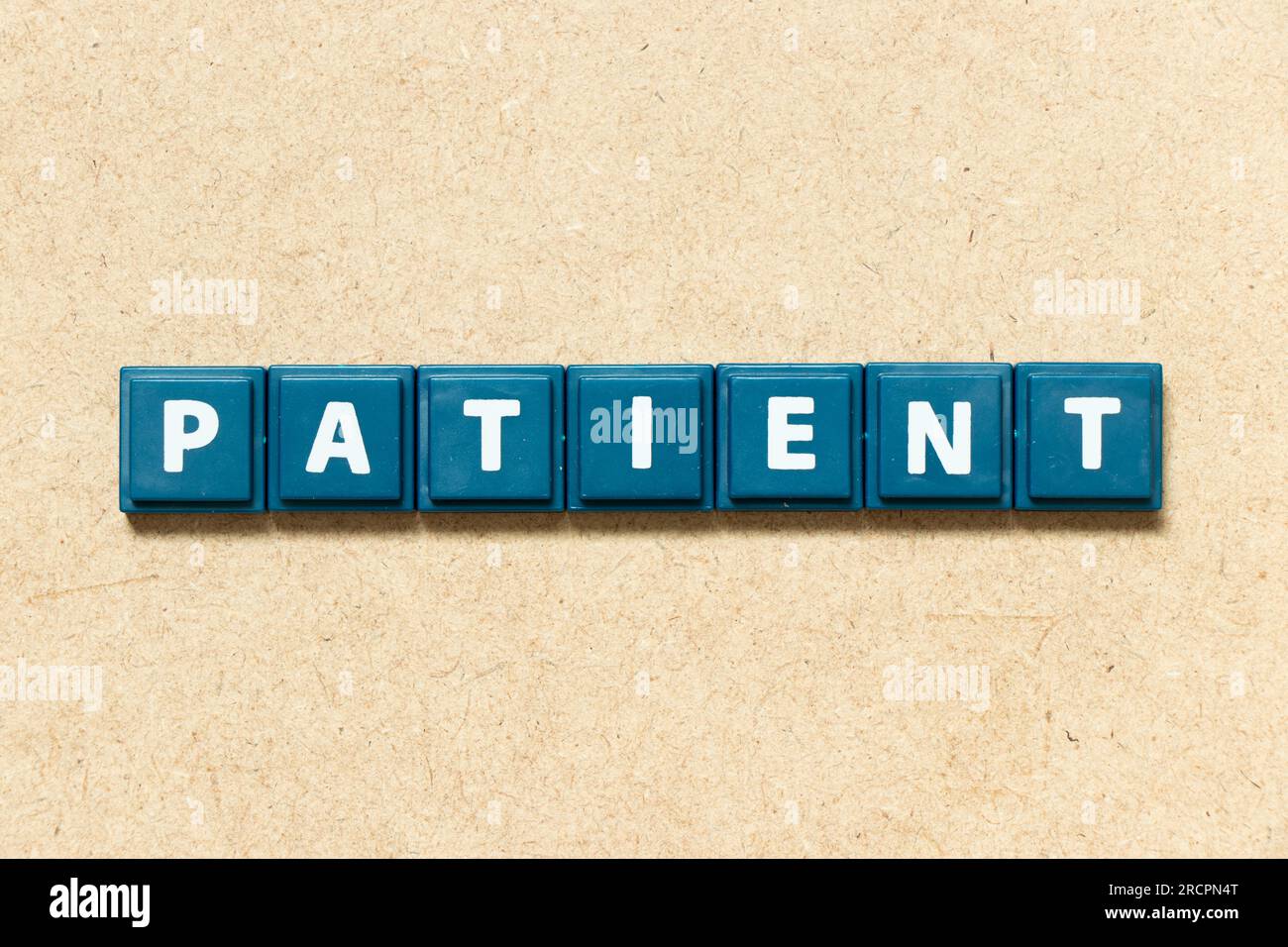 Tile alphabet letter in word patient on wood background Stock Photo - Alamy