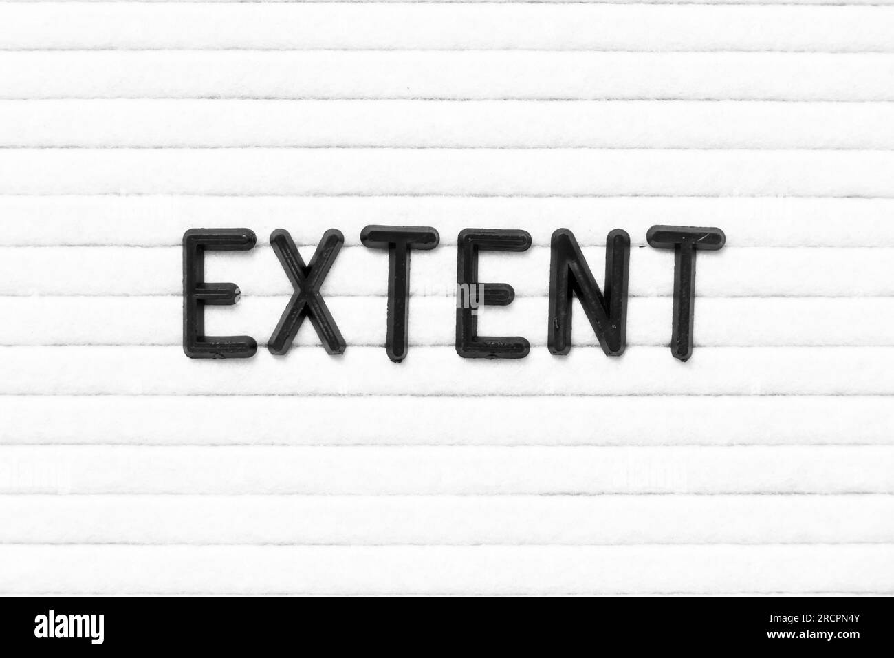 Black color letter in word extent on white felt board background Stock ...