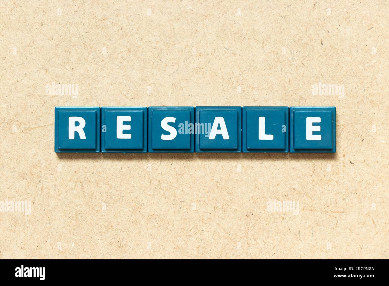 Tile alphabet letter in word resale on wood background Stock Photo - Alamy