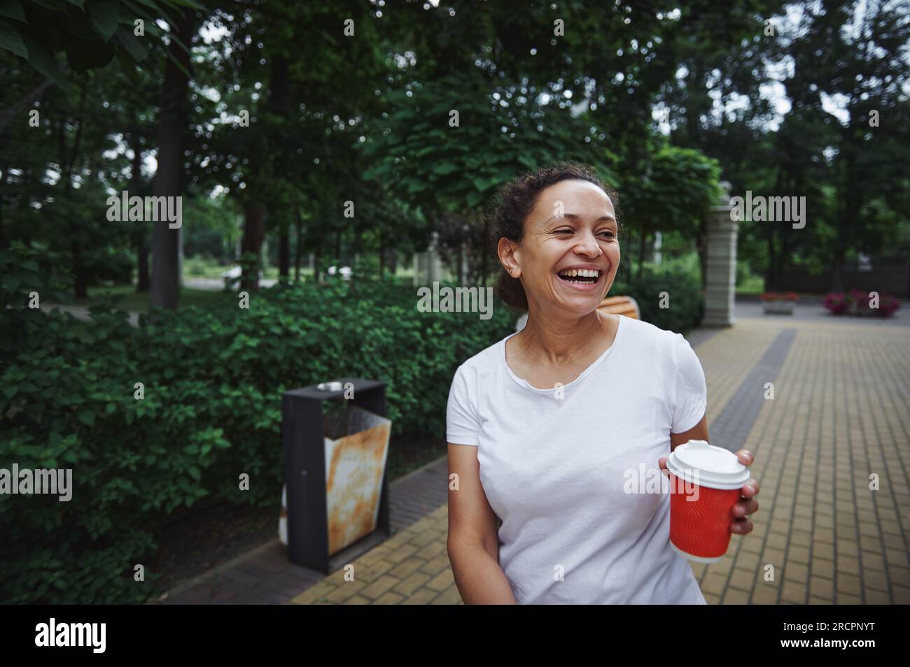 Portrait multi-ethnic woman laughing, smiling with a beautiful toothy ...