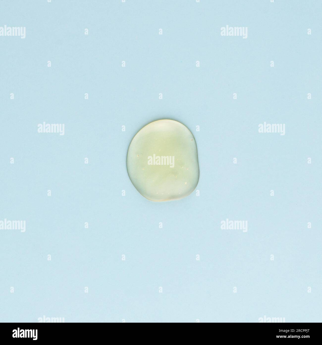 Drop of transparent face and body cream on a blue background Stock ...