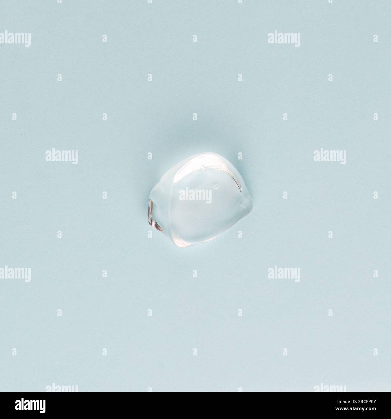 Drop of transparent face and body cream on a blue background Stock ...