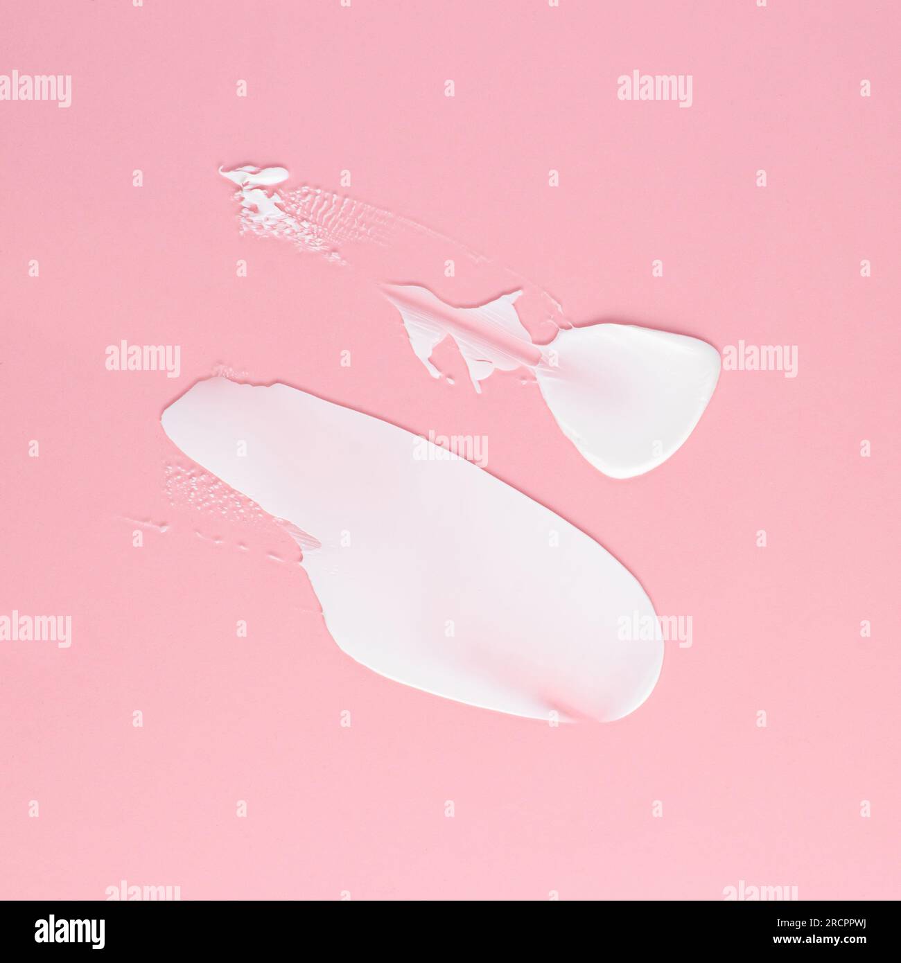Smear of white cream for face and body on a pink background Stock Photo ...