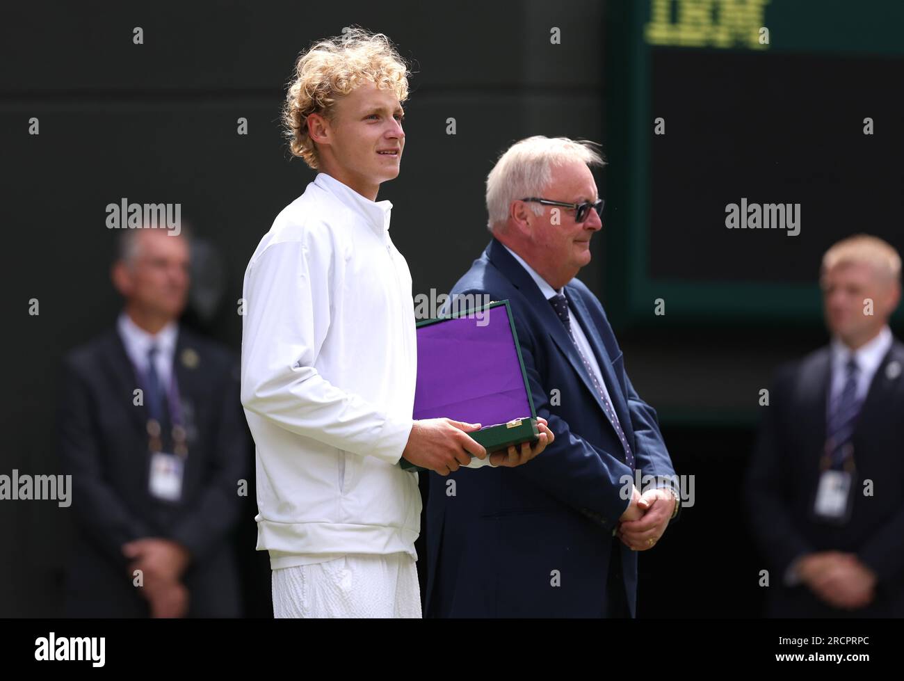 Yaroslav Demin with the runners up trophy following the Boys' Singles ...