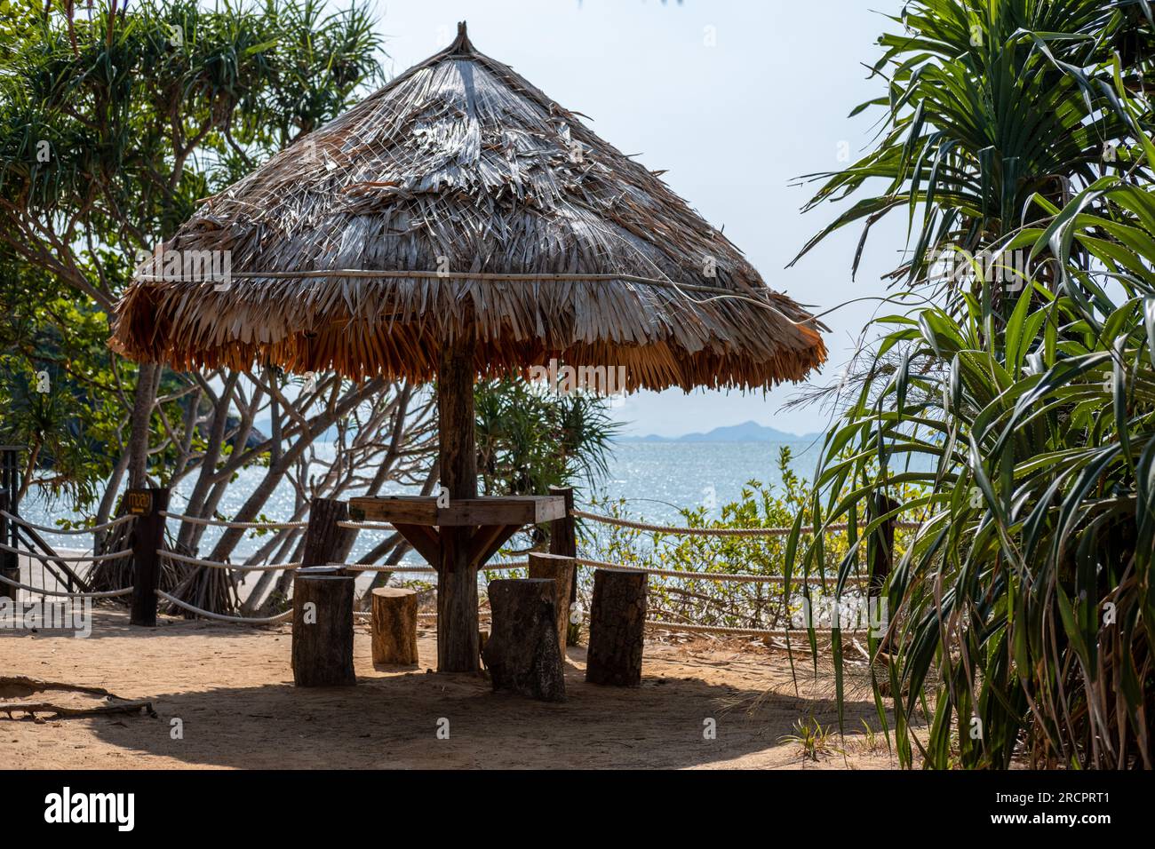 Seating under a wooden hut shelter, located by the sea Stock Photo - Alamy