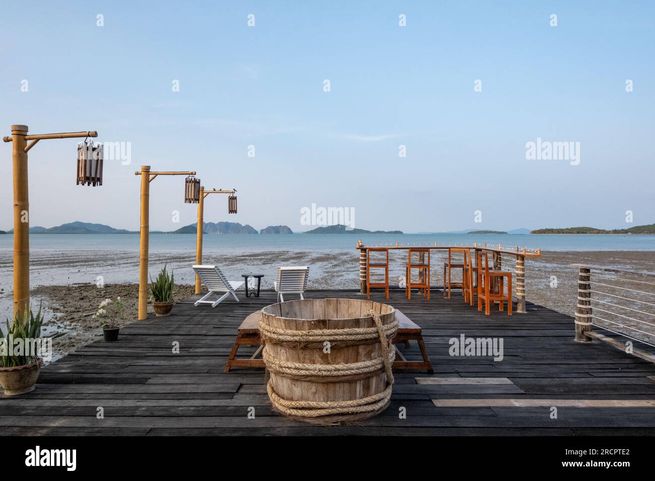 Outdoor seating and bar counter on the terrace, with view of the sea on ...