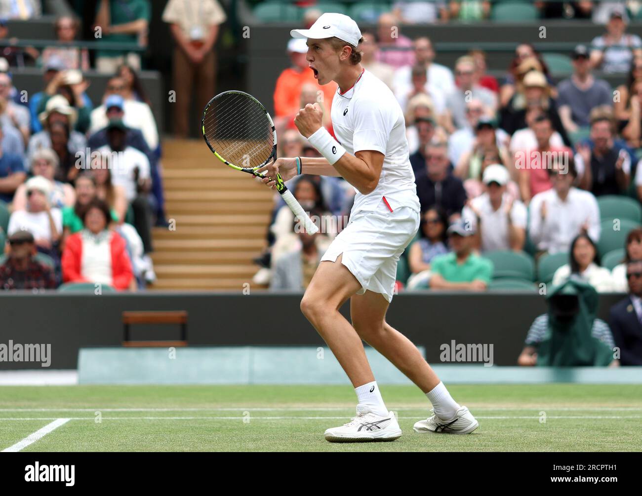 Henry Searle celebrates a point against Yaroslav Demin during the Boys ...