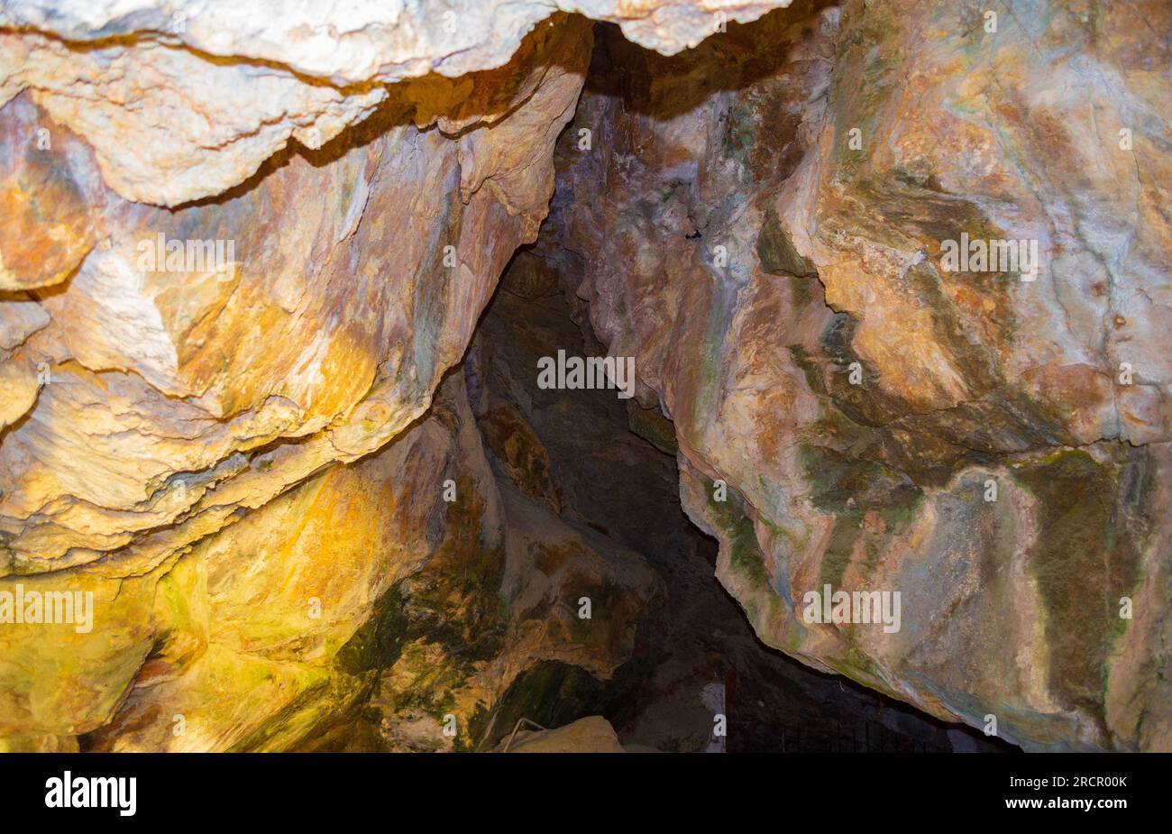 Colorful stones of Zoodochos Pigi Cave. The natural spring in the cave ...