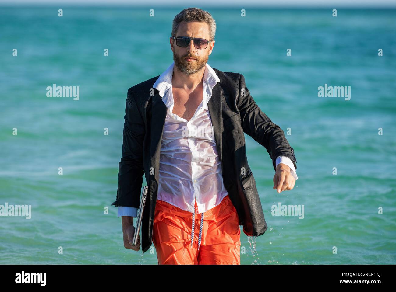 Hot business summer. business boss spending weekend at the beach ...