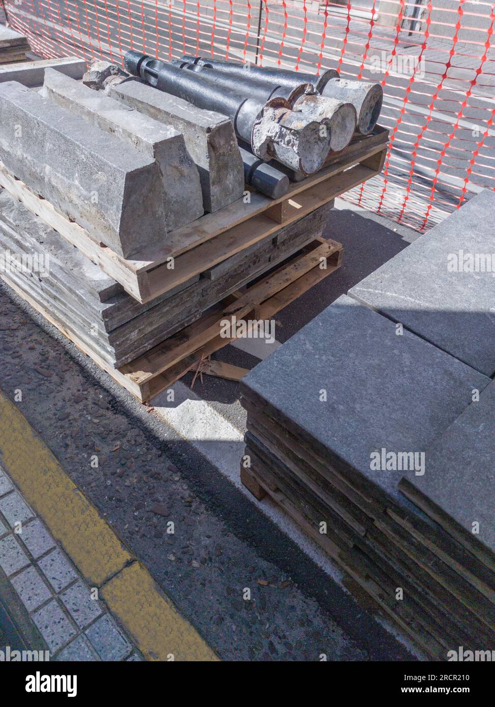 Bollards and curbs removed from the streets for the construction of a ...