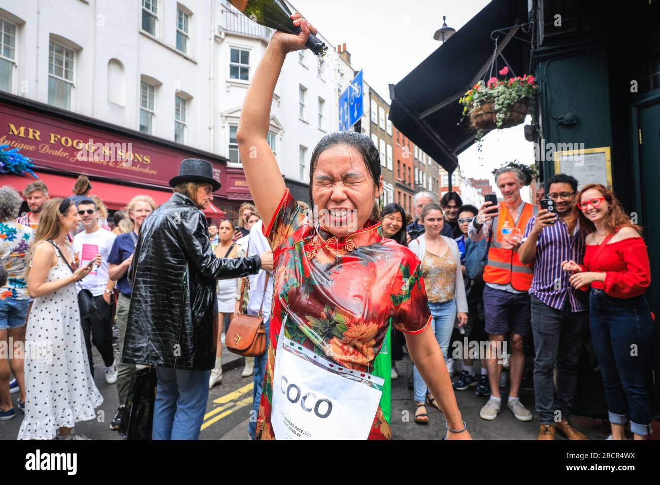 London, UK. 16th July, 2023. A waitress from Coco celebrates. The ...