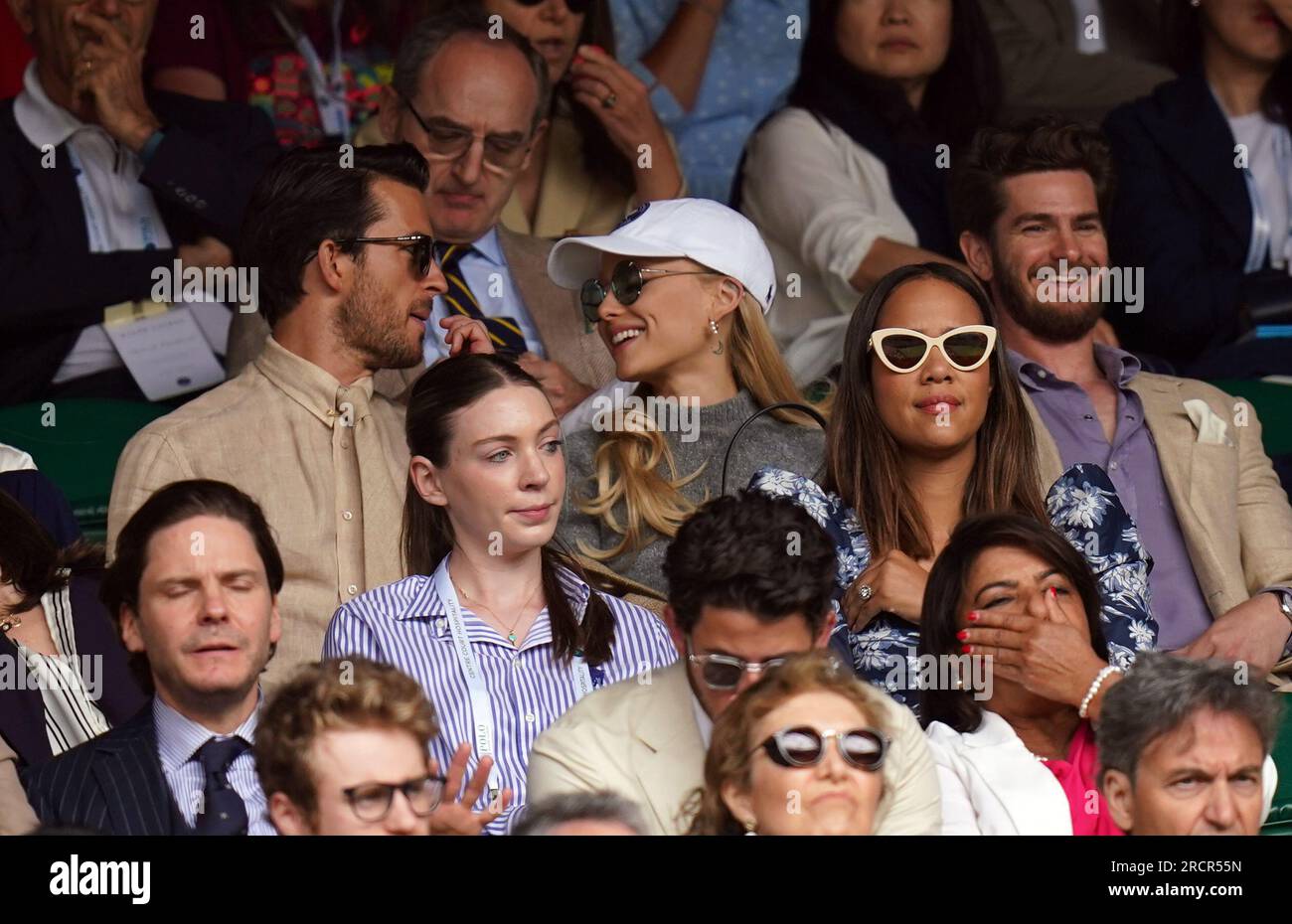 Jonathan Bailey and Ariana Grande alongside Andrew Garfield (right ...