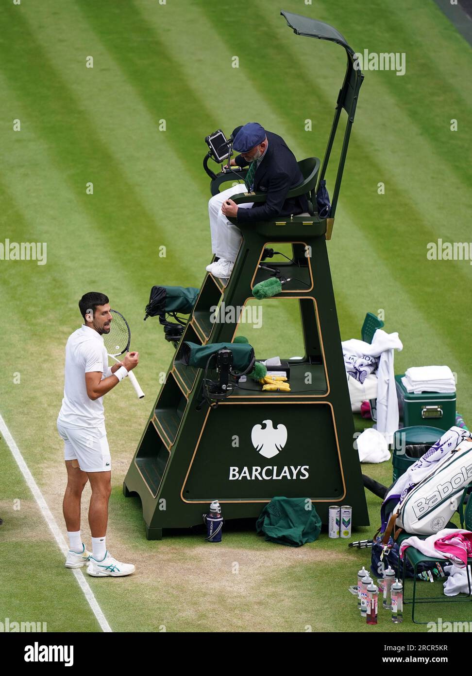 Chair Umpire, Fergus Murphy speaking with Novak Djokovic during the ...