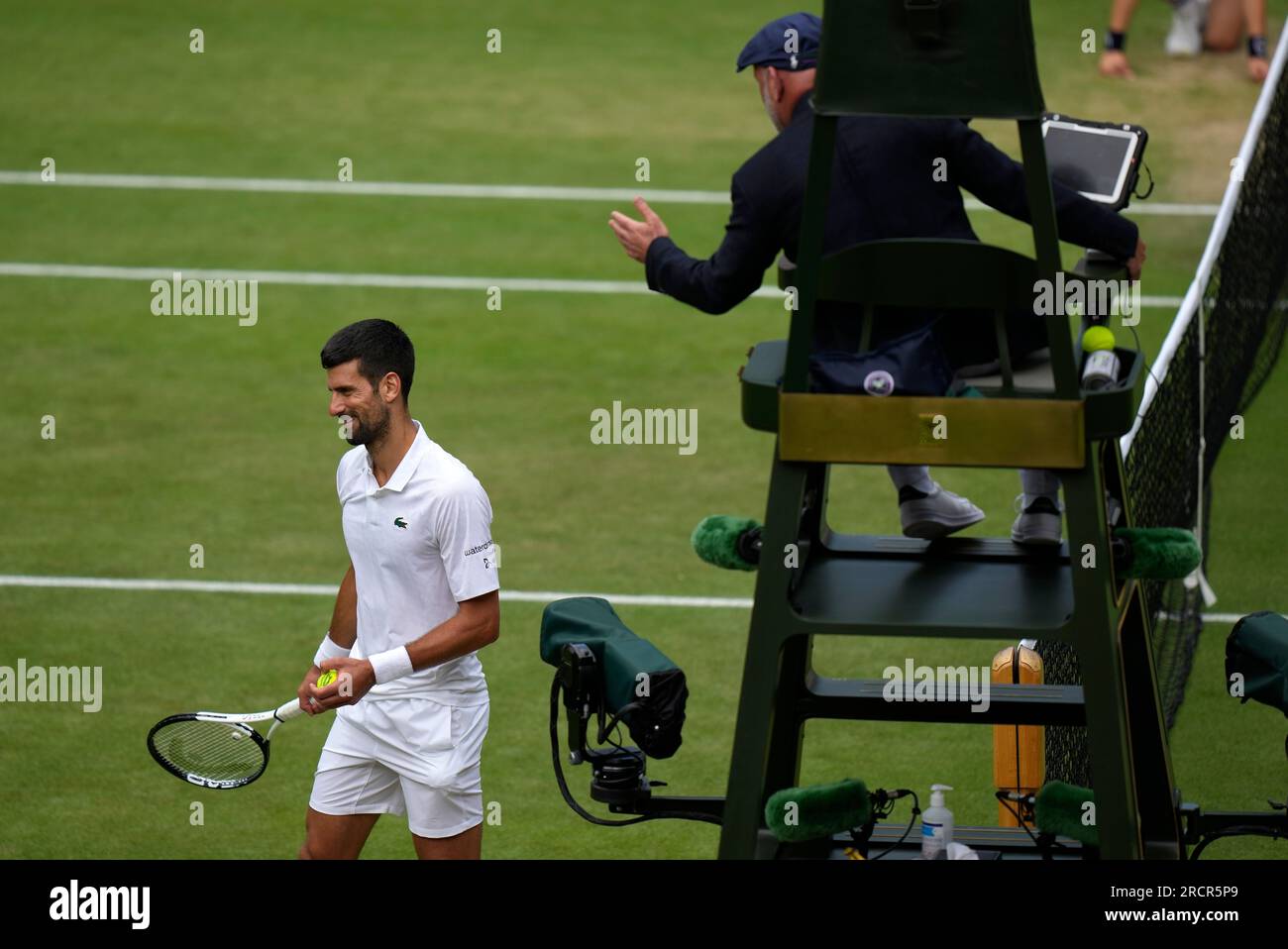 Serbia's Novak Djokovic smiles after questioning a call by umpire ...