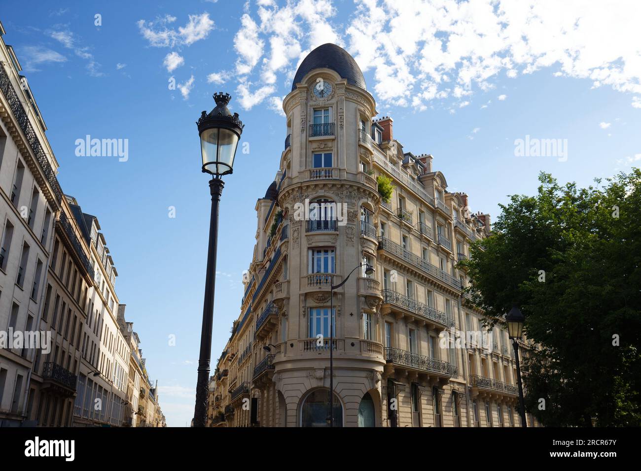 The facade of traditional French house with typical balconies and ...