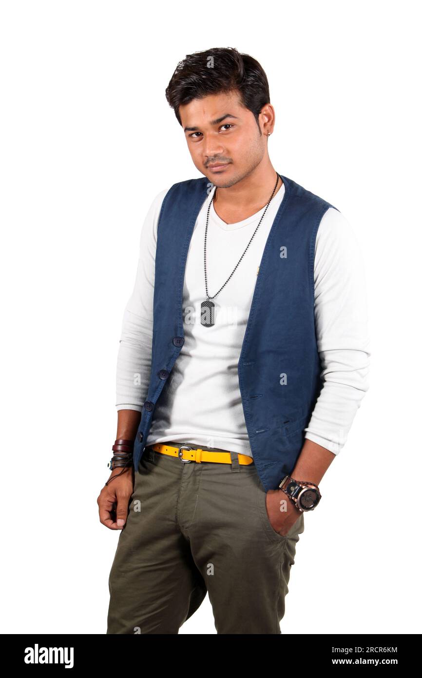 A handsome young Indian guy standing in style, on white studio ...
