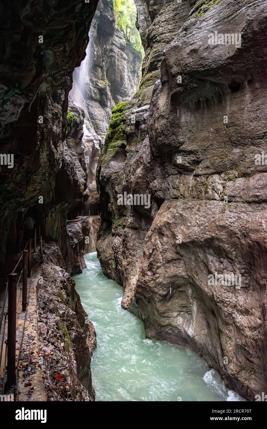 Hiking through the scenic Partnach gorge near Garmisch-Partenkirchen in ...