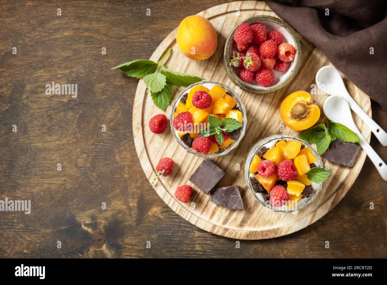 Triffle of chocolate biscuit with yogurt and fresh berries and fruits ...