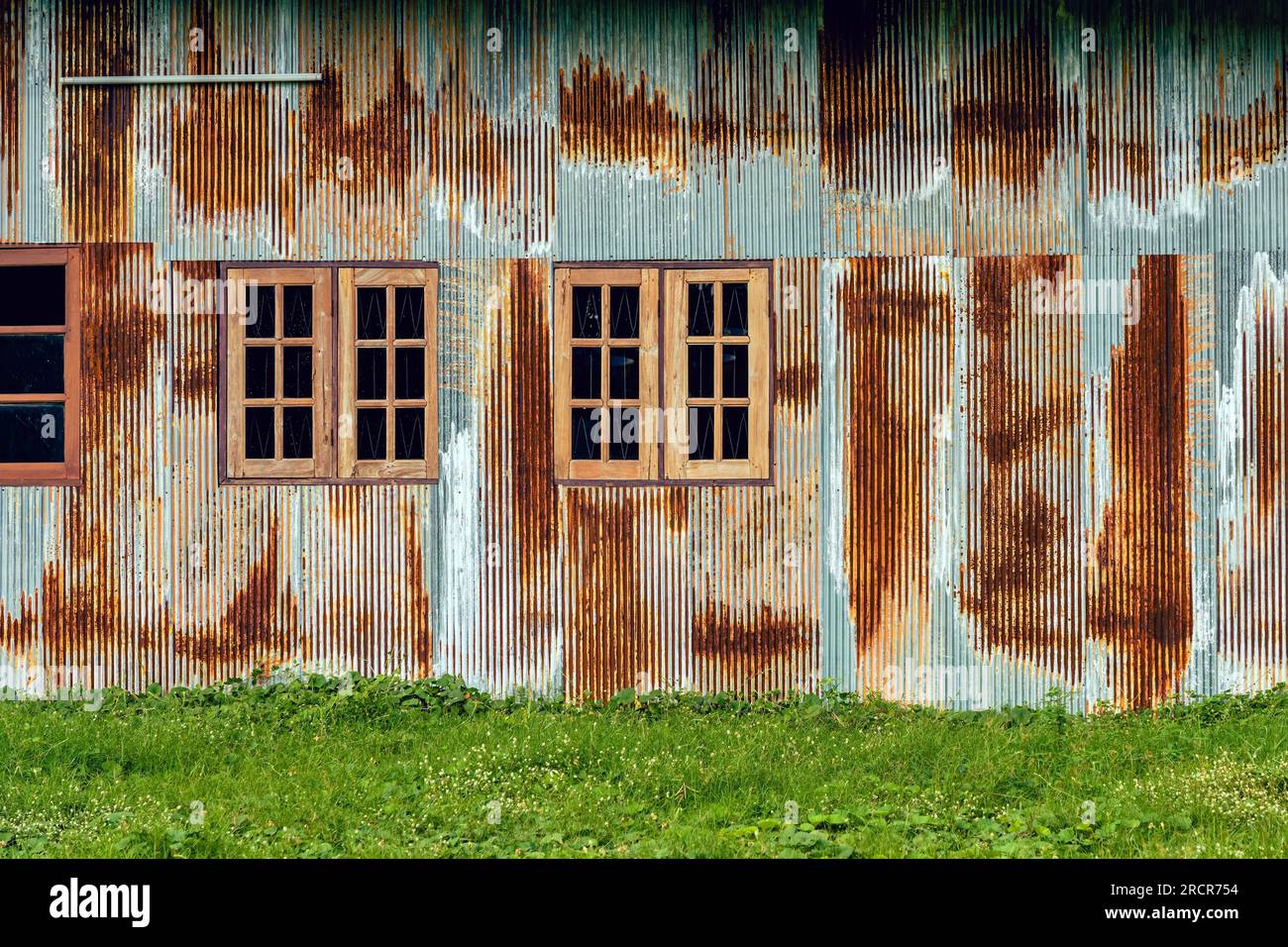 Facade house with old zinc wall. Beautiful vintage galvanized sheet ...