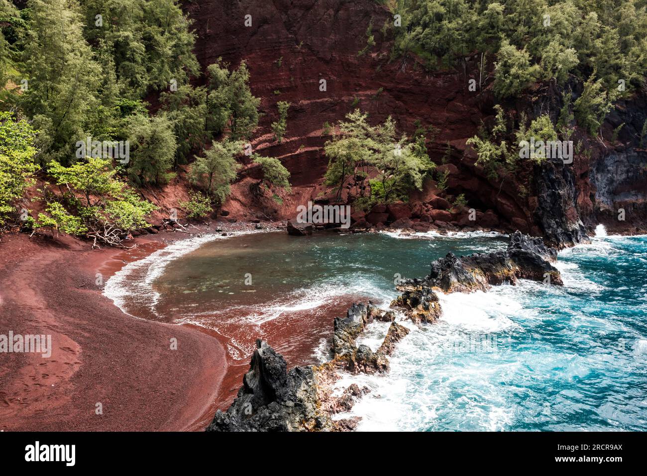 Red sand beach and its lagoon Stock Photo - Alamy