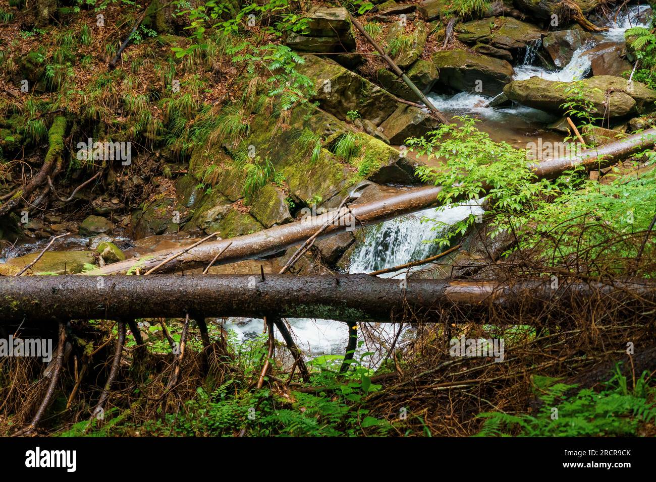 Waterfall cascade on mountain cliffs. Mountain waterfall in the ...