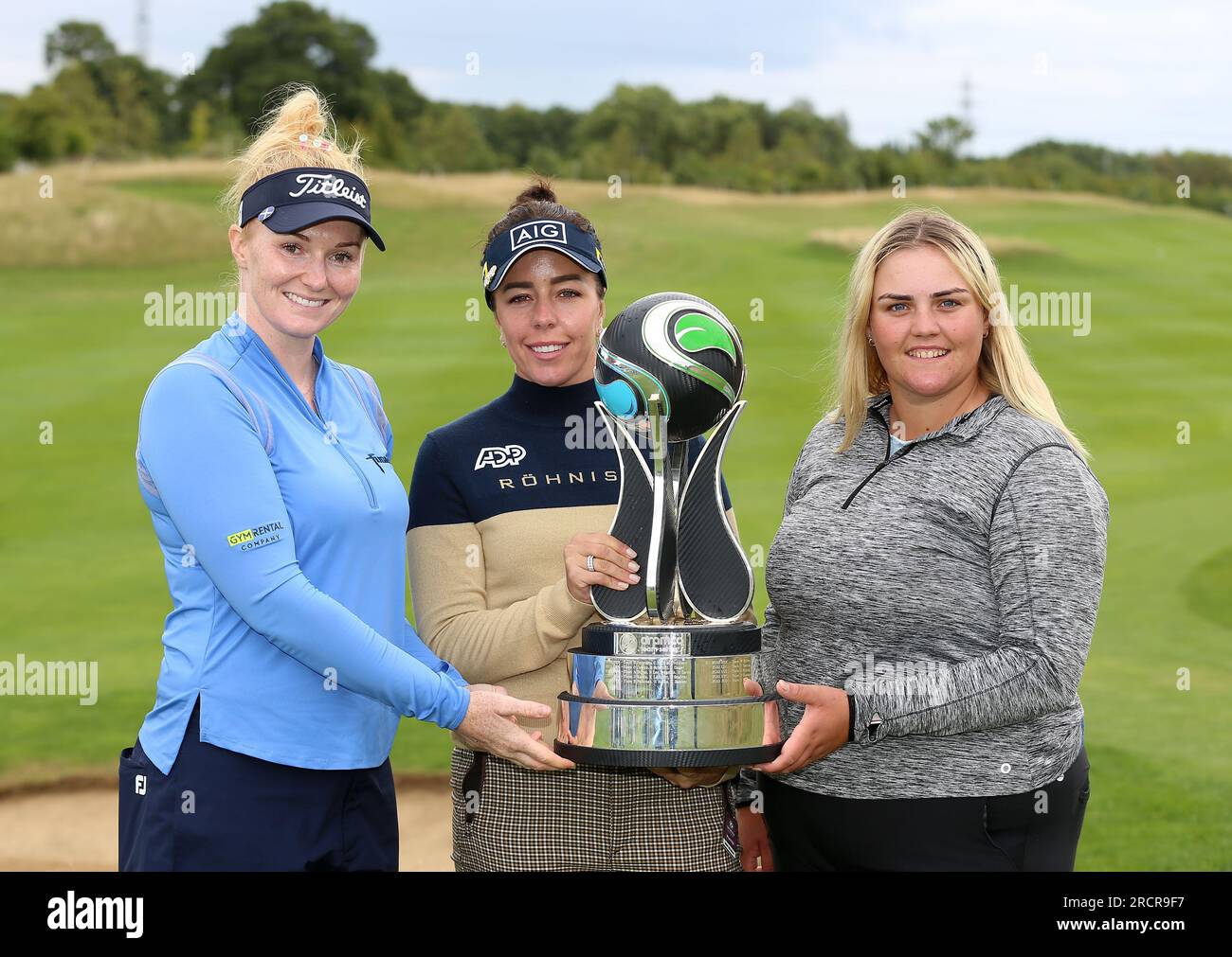 Kylie Henry, Georgia Hall and Lea Anne Bramwell lift the team trophy ...