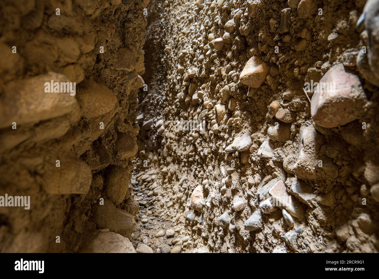 Close Up of A Narrow Path in a Cave with Sandstone Walls With Round ...