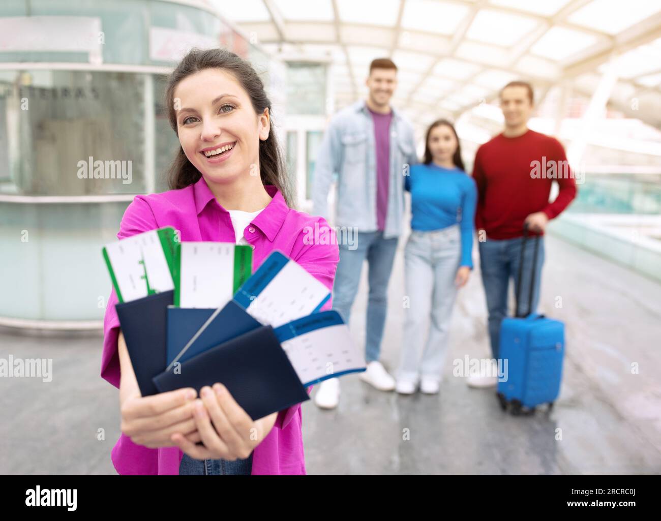 Happy Tourist Woman Showing Tickets Traveling With Friends In Airport ...
