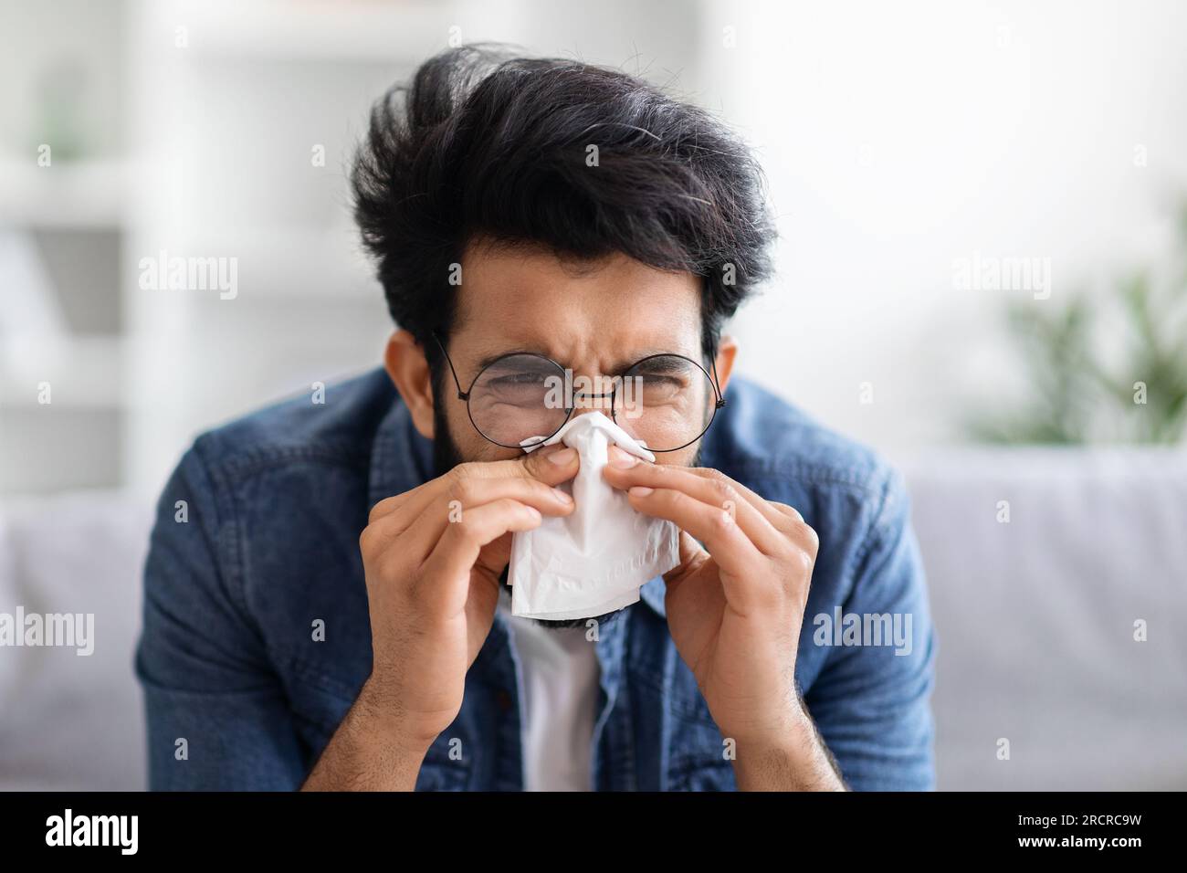 Indian man sneezing hi-res stock photography and images - Alamy