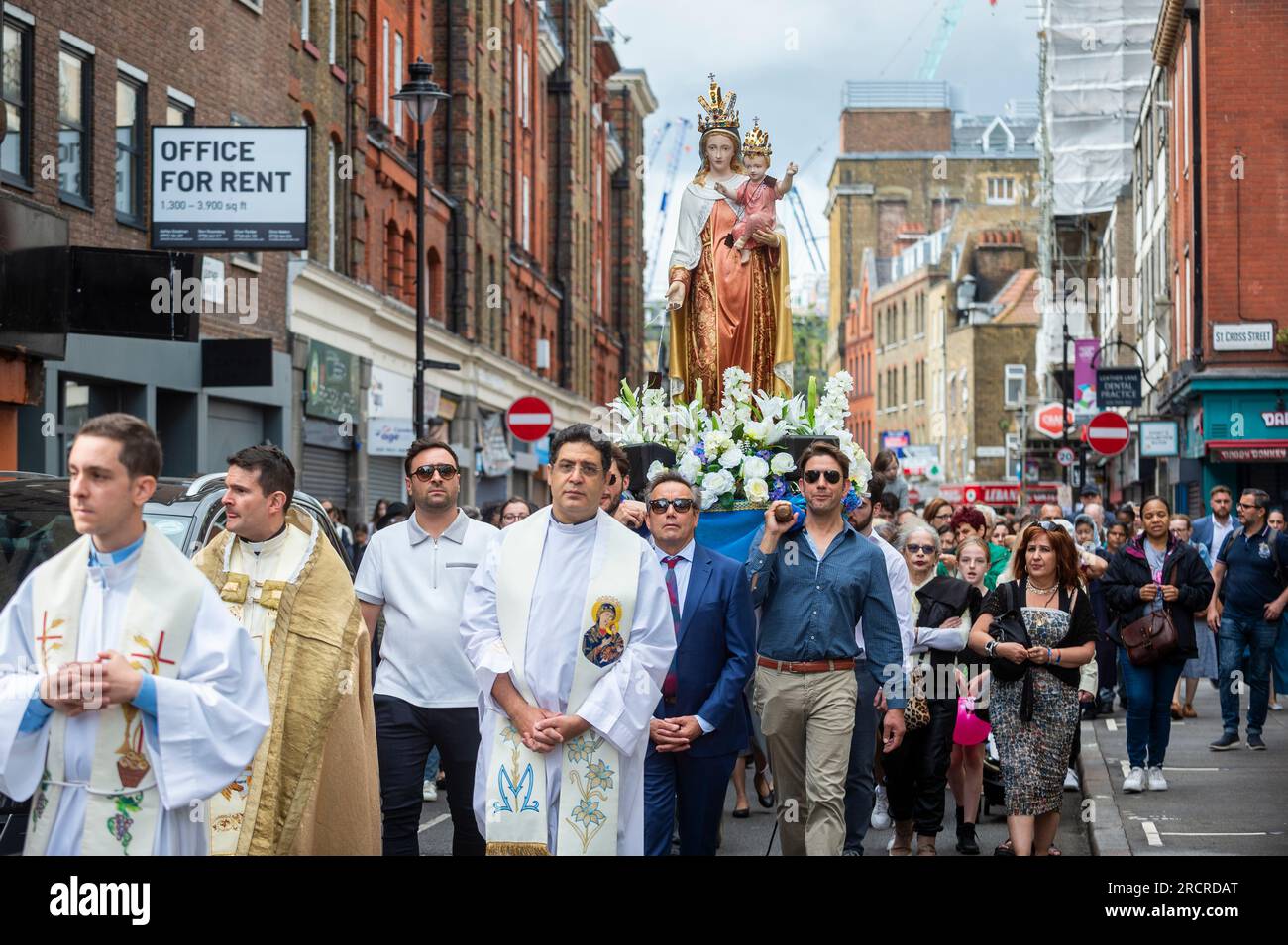 London, UK. 16 July 2023. People carry the statue of Our Lady of Mount ...